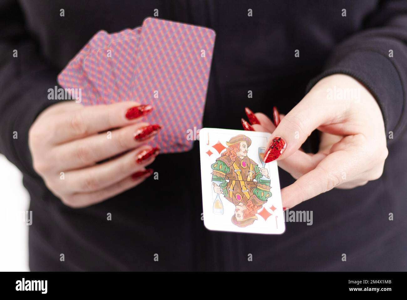 Female hands hold a deck of cards and show tricks Stock Photo - Alamy