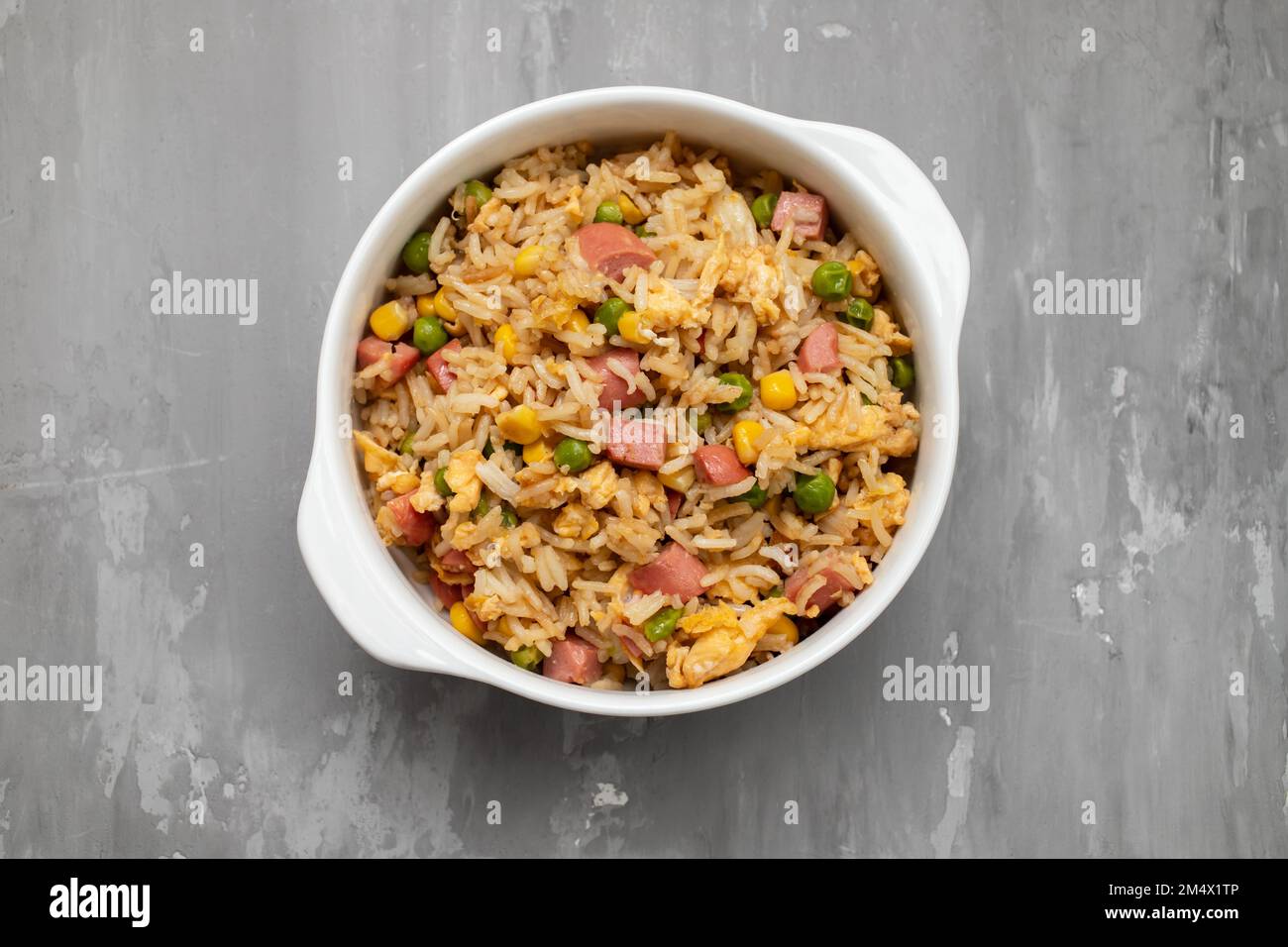 Rice with corn. peas, ham on white small bowl Stock Photo - Alamy