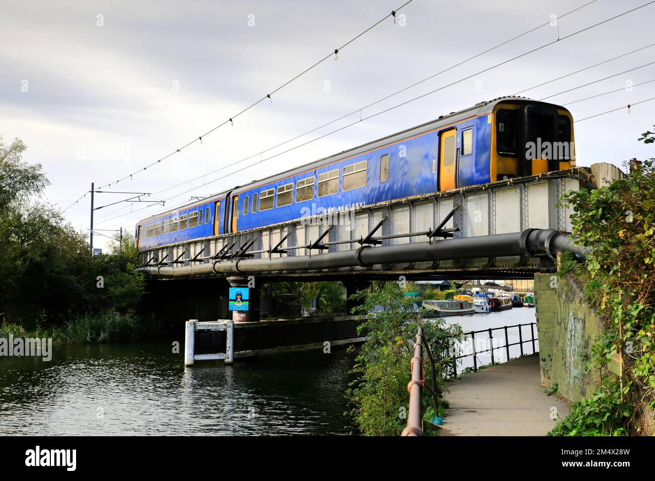 EMR Regional train over the river Great Ouse, Ely city, Cambridgeshire ...