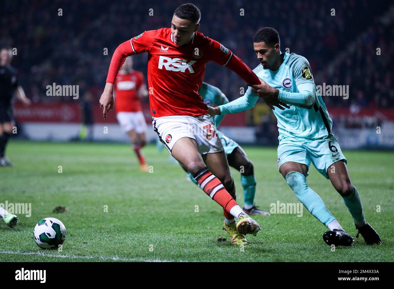 Miles Leaburn of Charlton Athletic on the ball holds off Levi Colwill ...