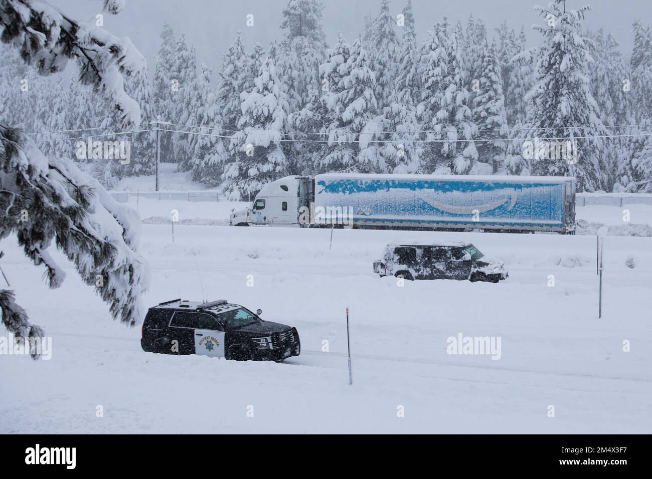 Hazardous Driving Conditions Over Donner Pass. An Amazon truck waiting out the storm Highway 80 ...