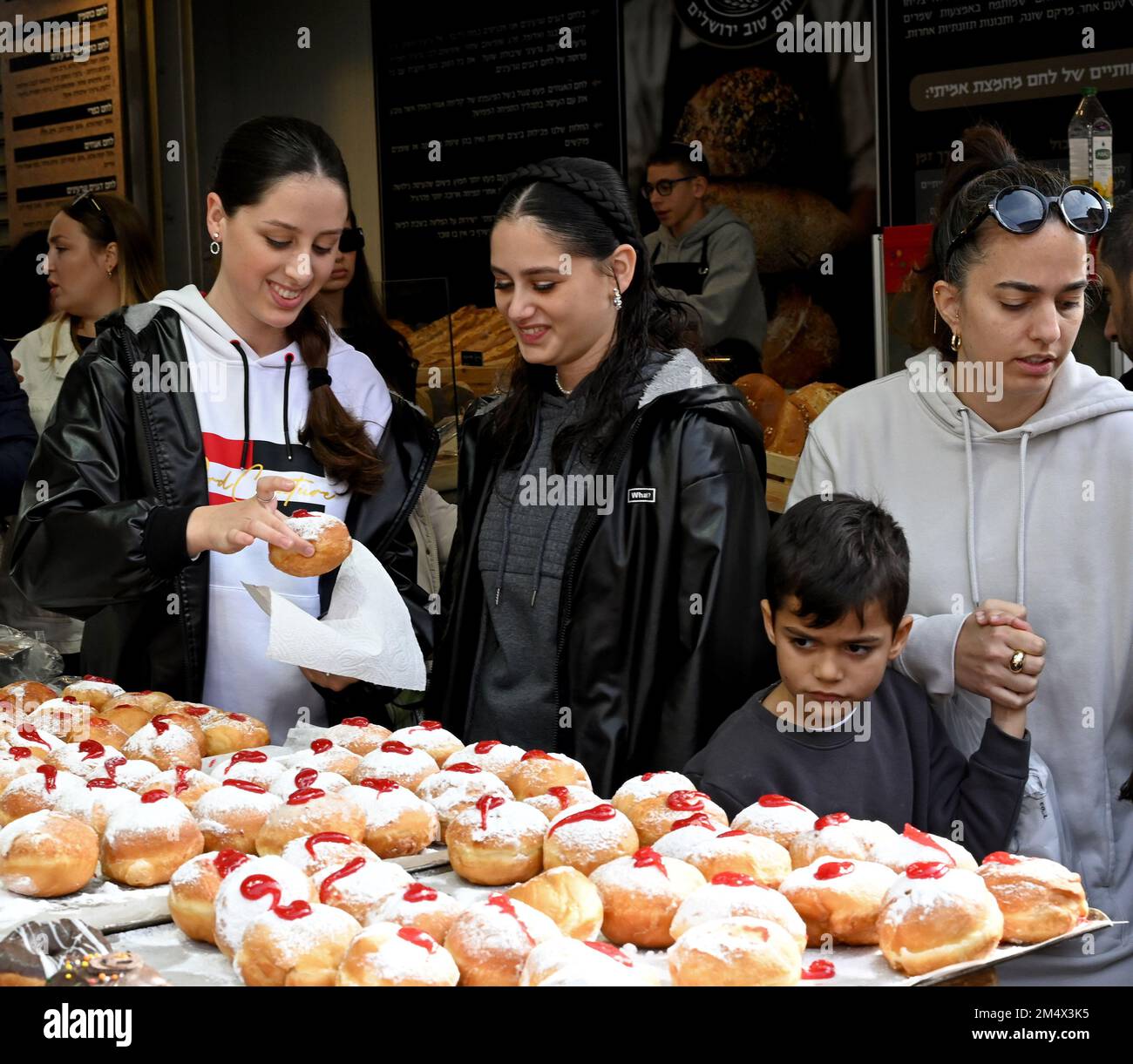 Jerusalem, Israel. 23rd Dec, 2022. Israelis buy sufganiyot, round ...