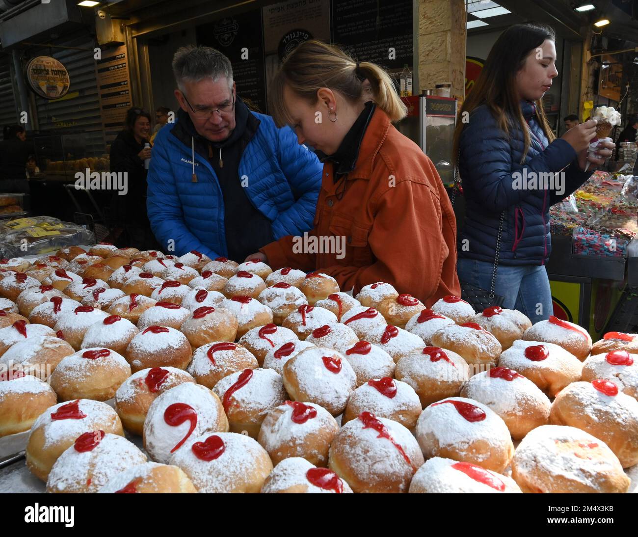Jerusalem, Israel. 23rd Dec, 2022. Israelis buy sufganiyot, round ...