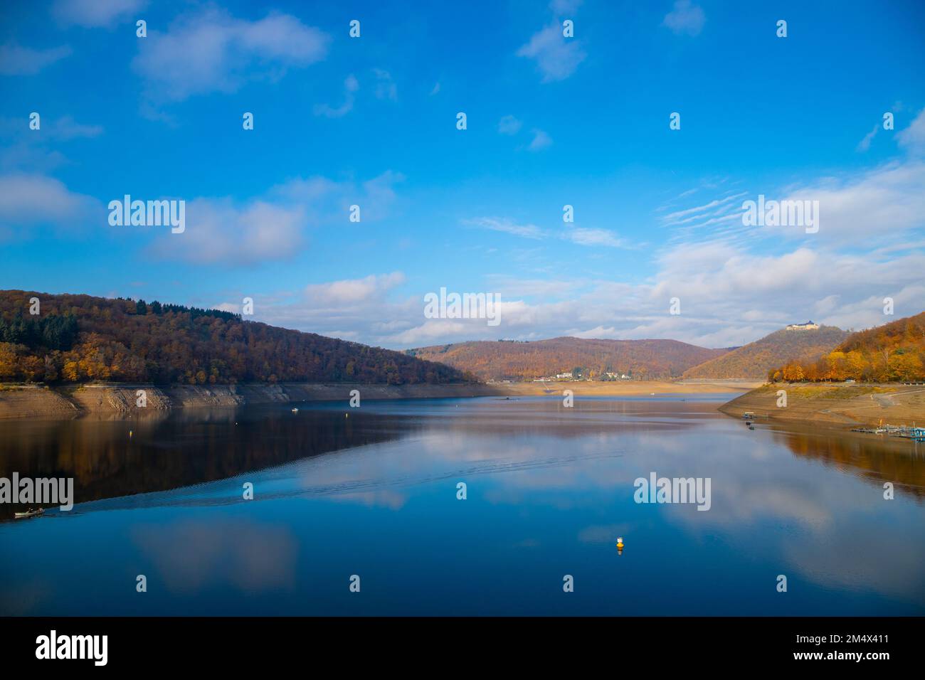 Lake in autumn with colorful autumn forest and few houses in the ...