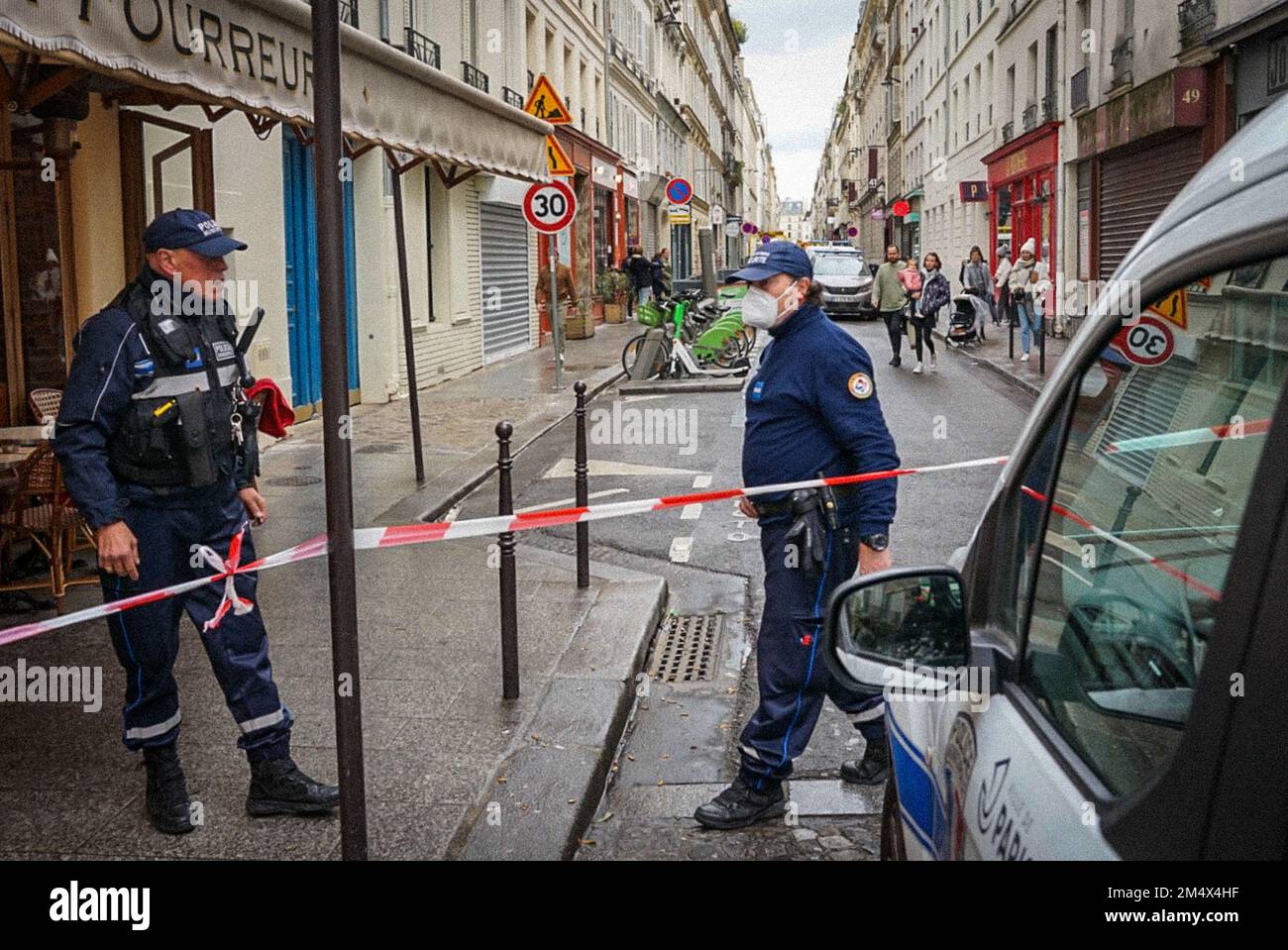 Police officers seen setting a cordon line for investigation. French ...