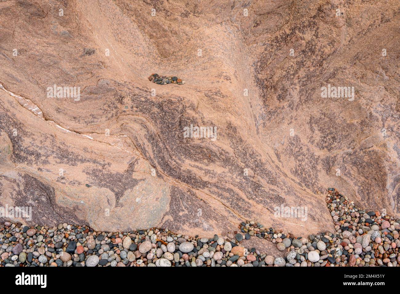 Wave-polished cobblestones and rocks at Sawpit Bay, Sawpit Bay, Ontario ...