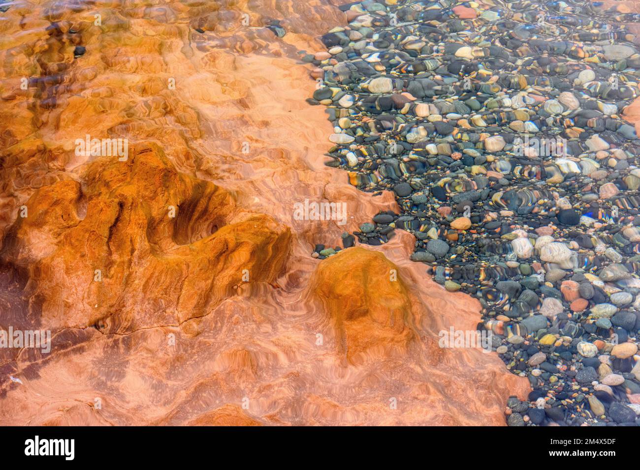 Wave-polished cobblestones and rocks at Sawpit Bay, Sawpit Bay, Ontario ...