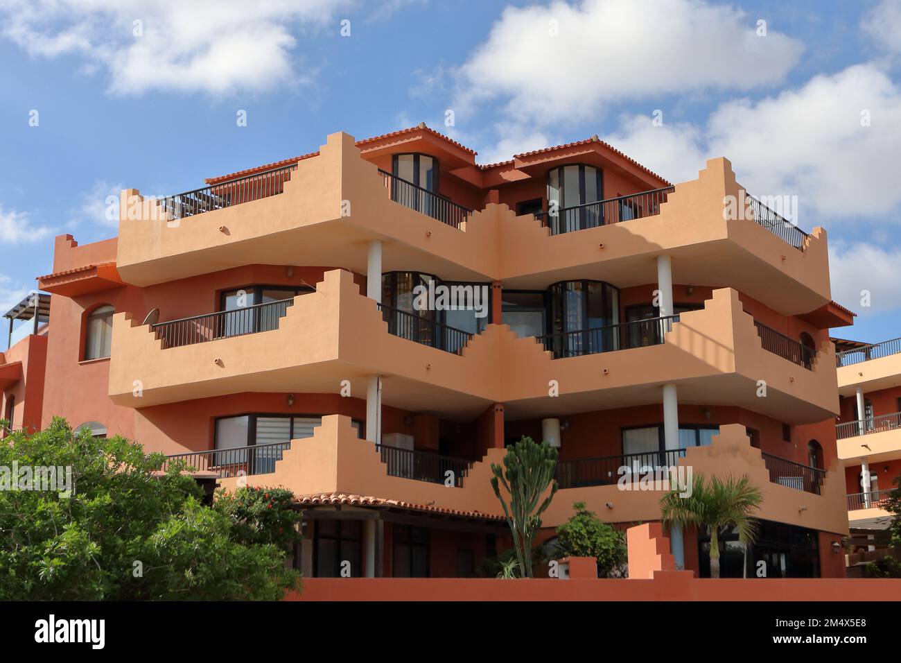 a 4 story building with balconies Stock Photo - Alamy