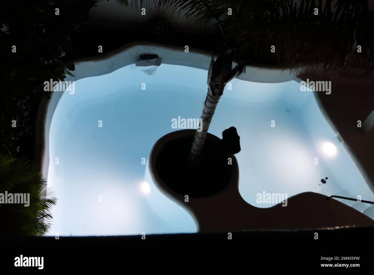 a small swimming pool at night illuminated with lights Stock Photo - Alamy