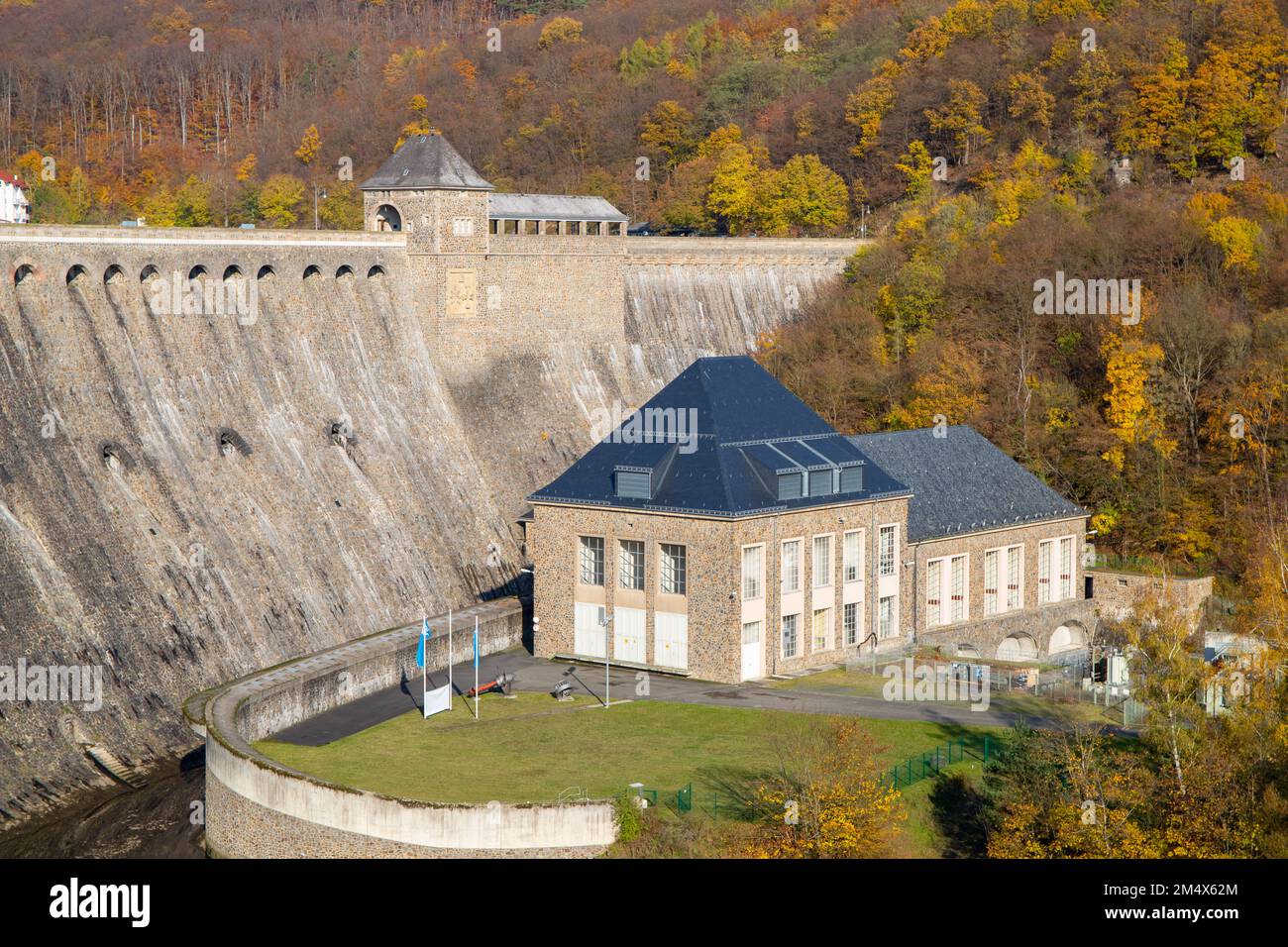 Autumn forest by a river from a dam, colorful colors. High quality ...