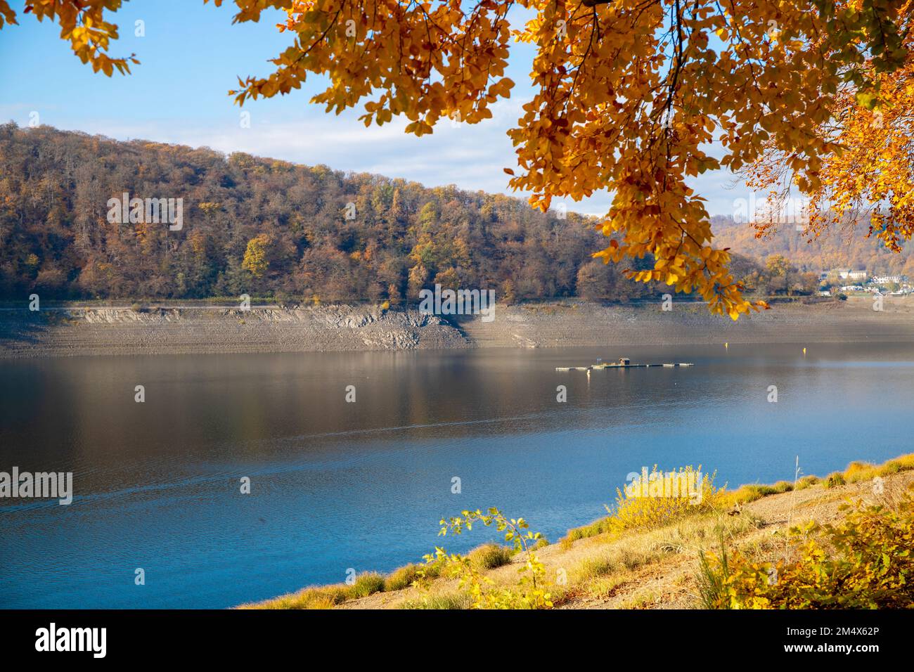Lake in autumn with colorful autumn forest and few houses in the ...