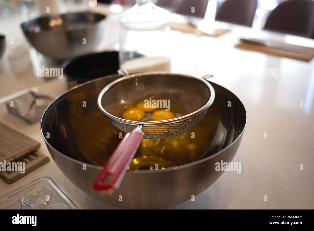 eggs in a bowl on the kitchen table for making a pie at a culinary ...