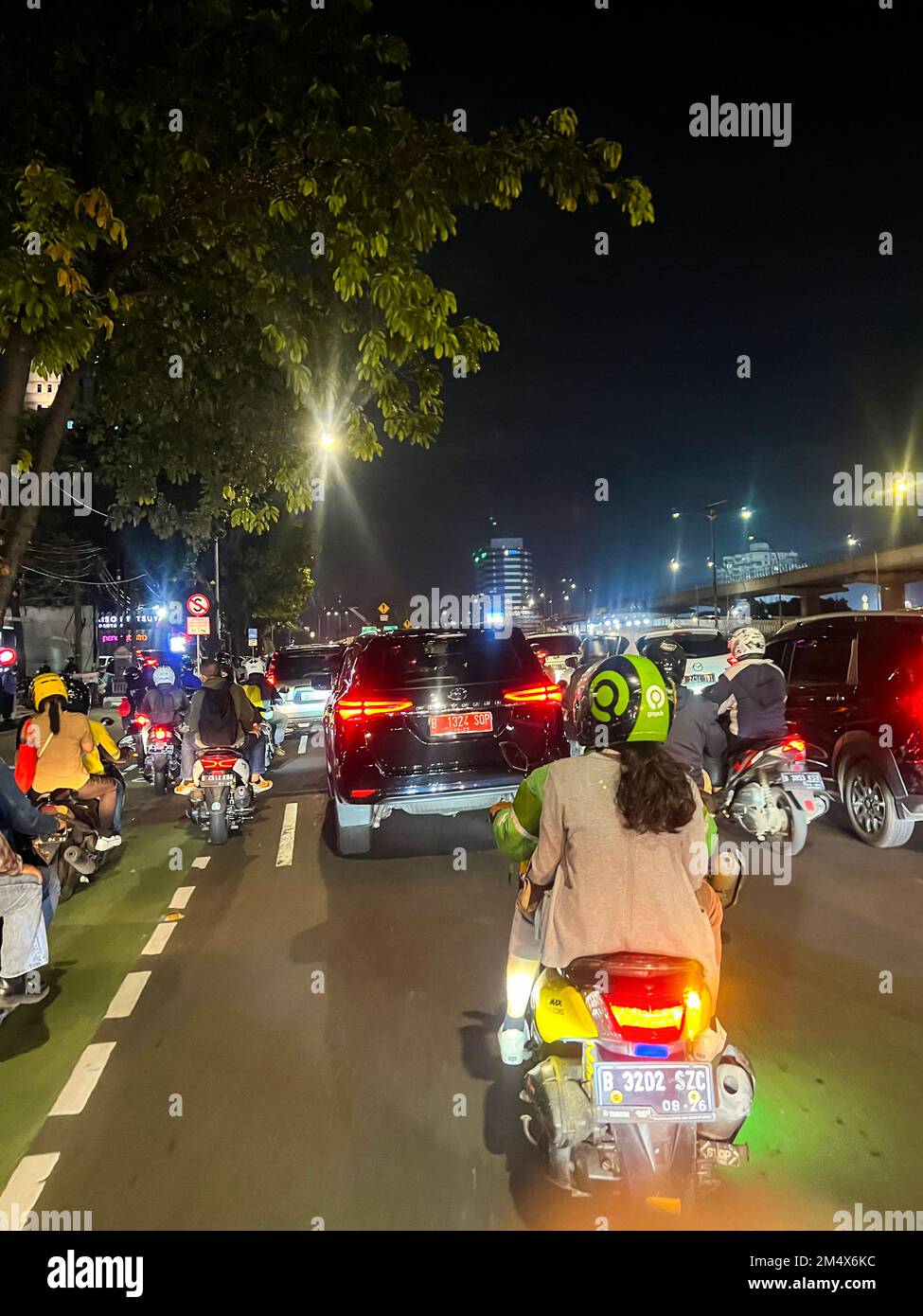 Night view busy in Jakarta Motorway traffic jam at night. Jakarta ...