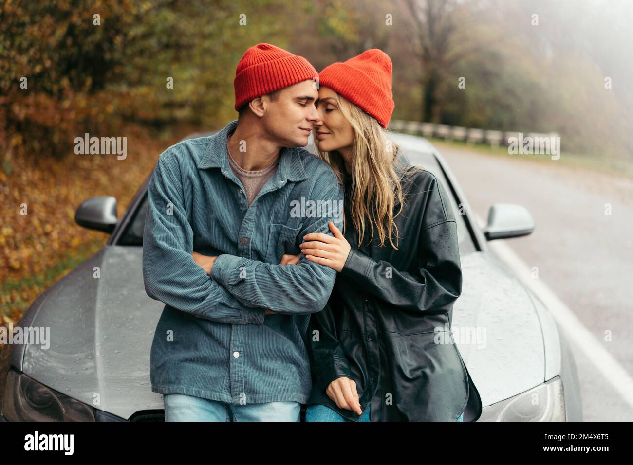 Boyfriend and girlfriend is embarrassing on the road near by car Stock ...