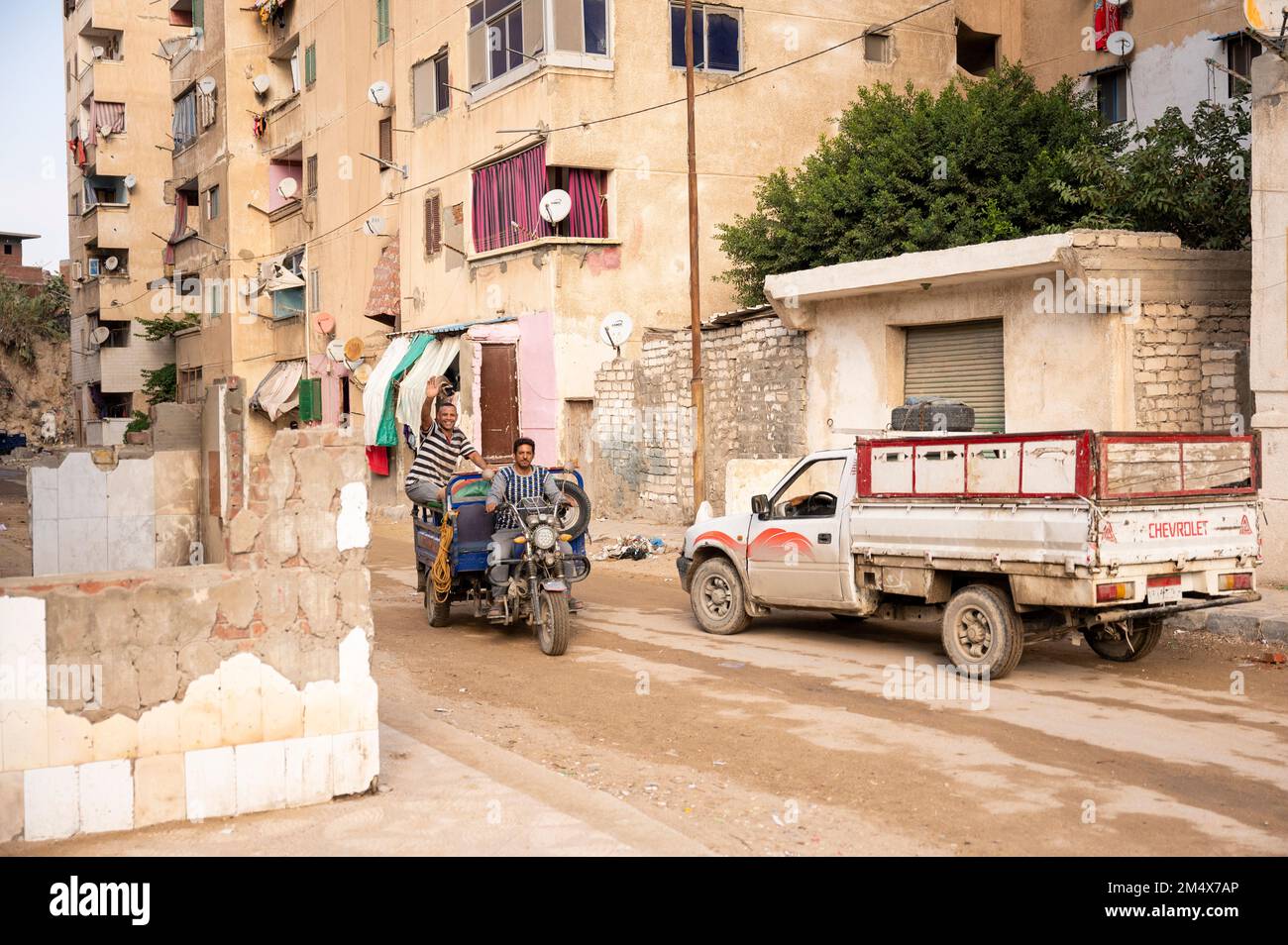 Alexandria, Egypt. 13th Nov, 2022. Two men are riding a motorized three ...