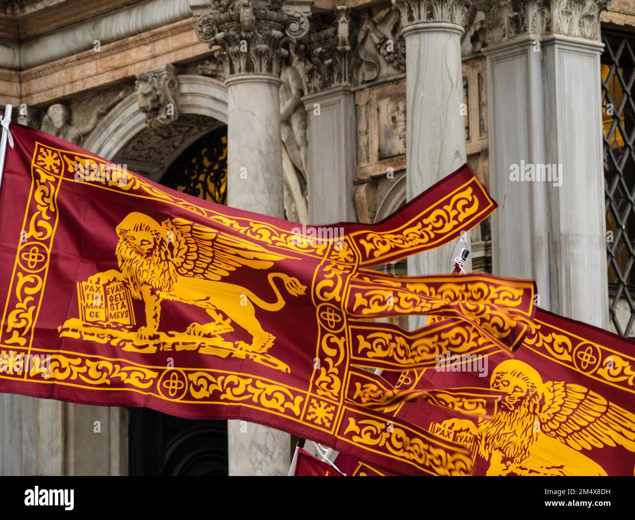 The flag of Venice outside the Basilica of St Mark's, Piazza San Marco ...