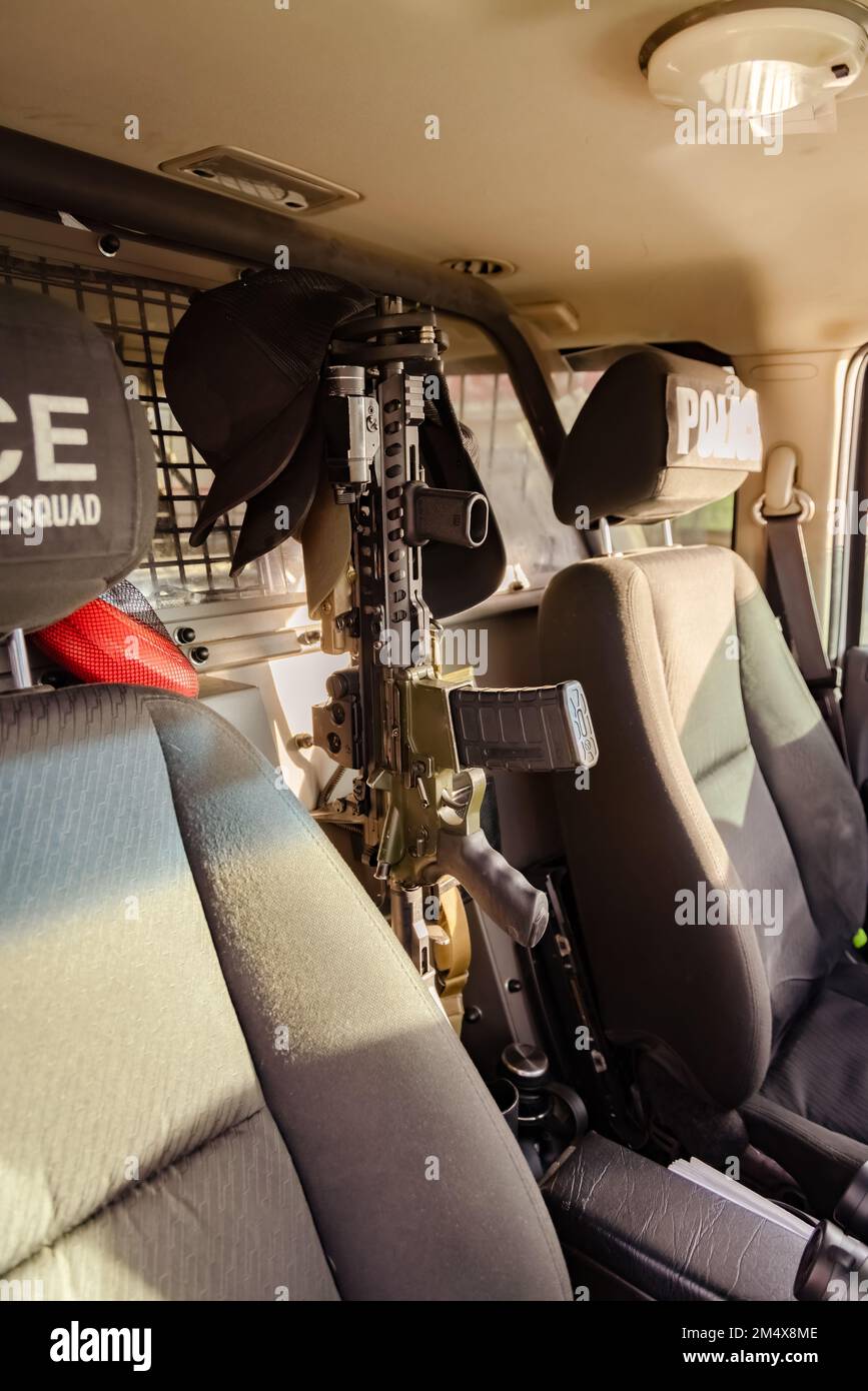 The inside of a police officers vehicle where it says police on seat ...