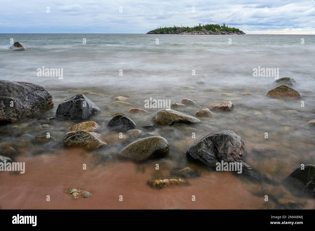 Lake Superior beach with wave rounded rocks, Lake Superior Provincial ...