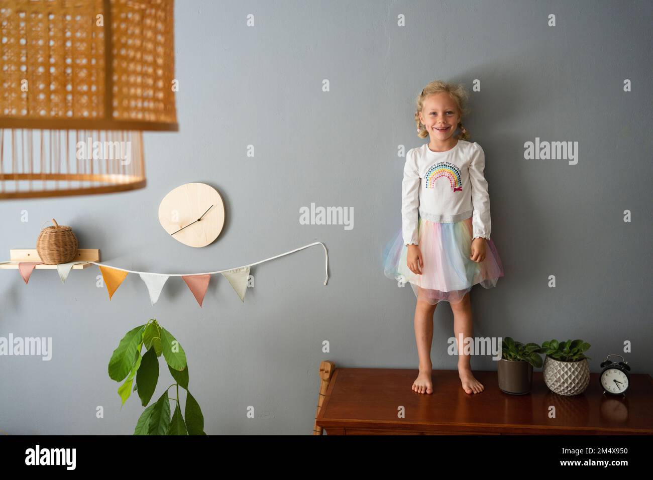 Girl standing on table hi-res stock photography and images - Alamy