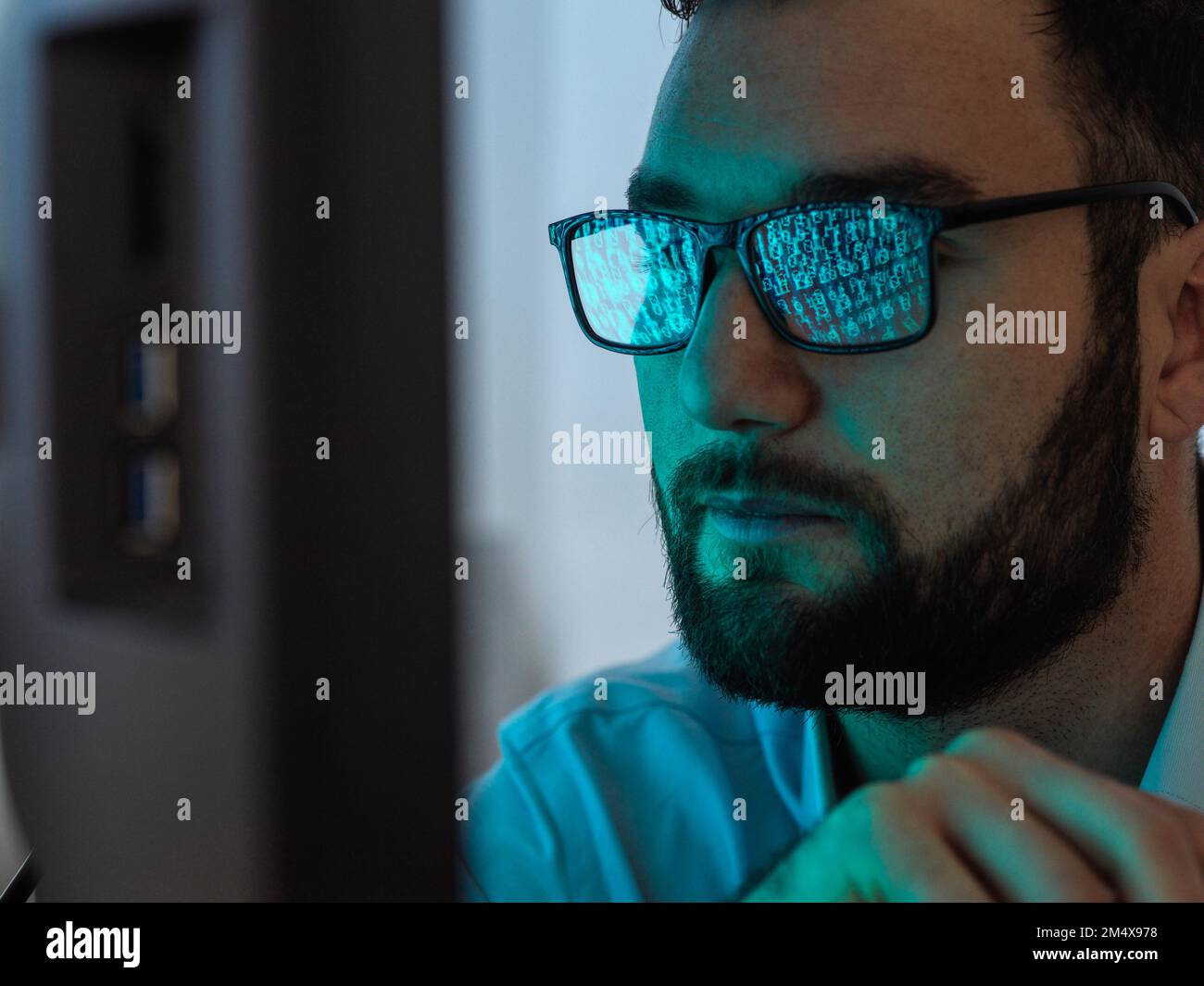Programmer with eyeglasses hacking computer with virus Stock Photo - Alamy