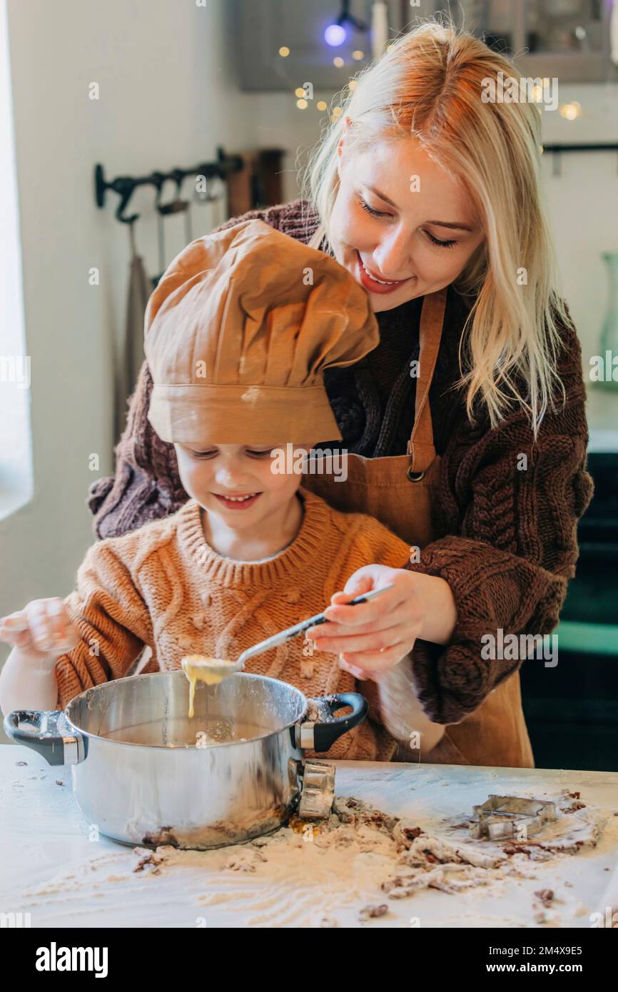 Happy mother and son preparing cookies at home Stock Photo - Alamy