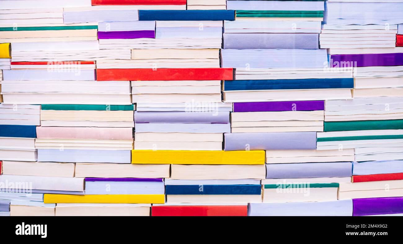Full frame of colorful books stacked on each other at store Stock Photo ...