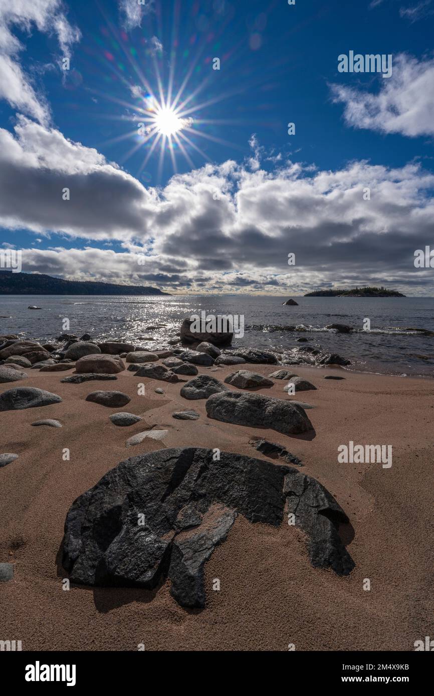 Sand beach and wave-polished rocks, the Lake Superior shoreline, Lake ...