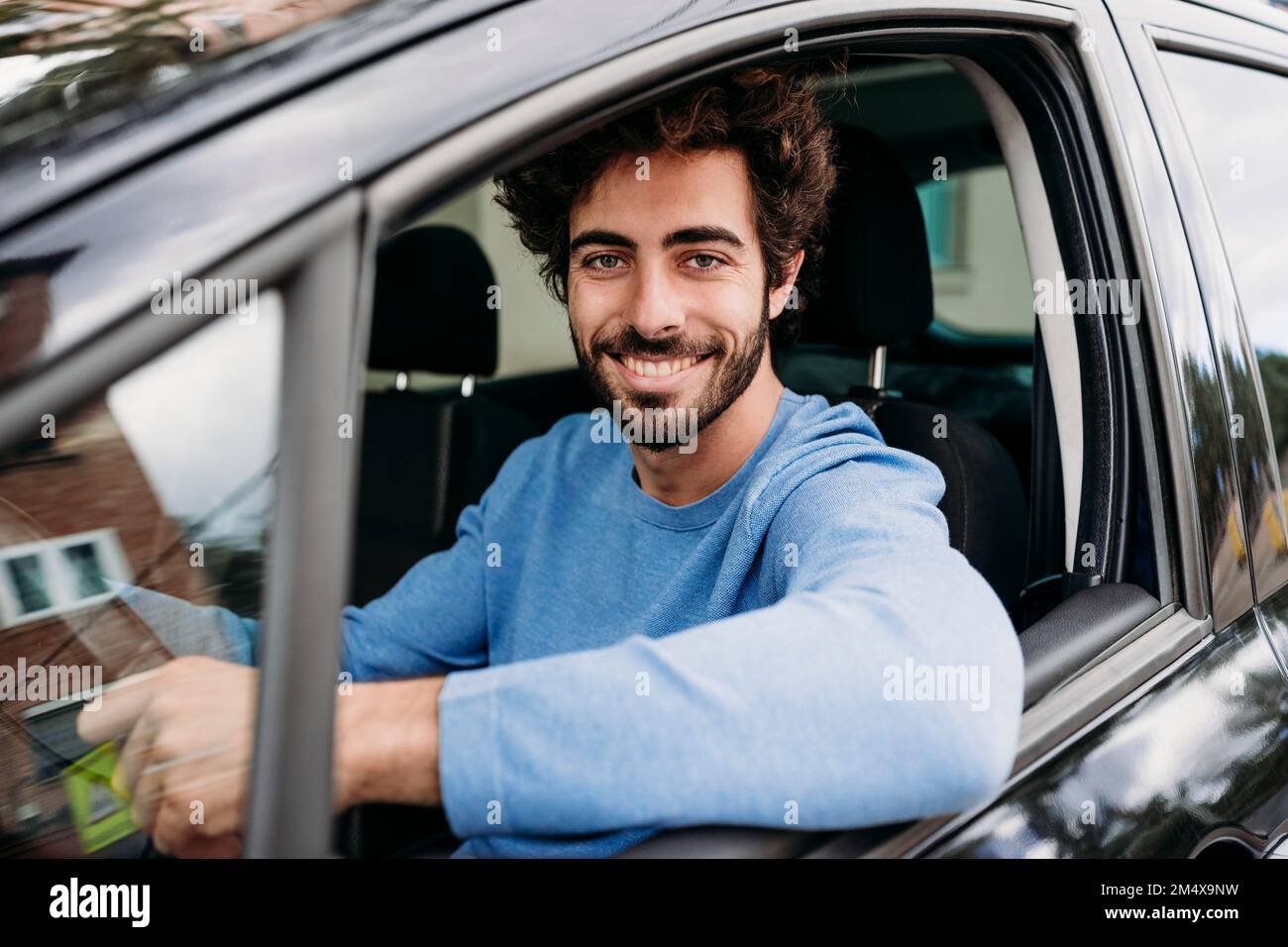 Young handsome man in car hi-res stock photography and images - Alamy