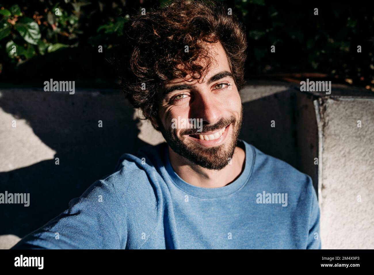 Happy man with sunlight on face Stock Photo - Alamy