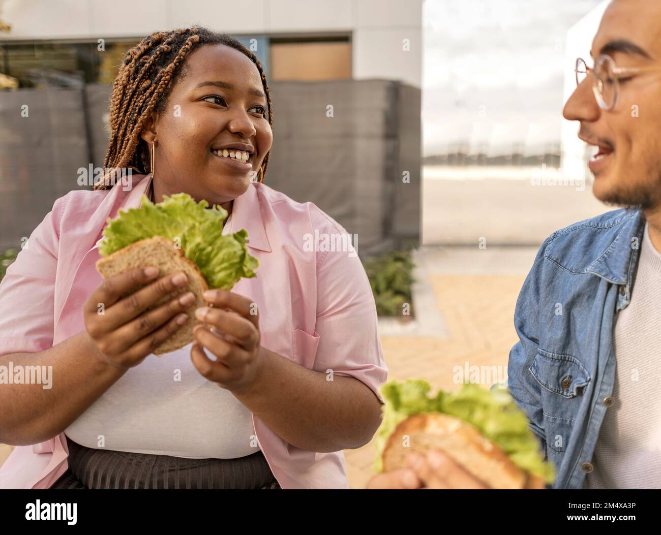 Man eating sandwich standing hi-res stock photography and images - Alamy