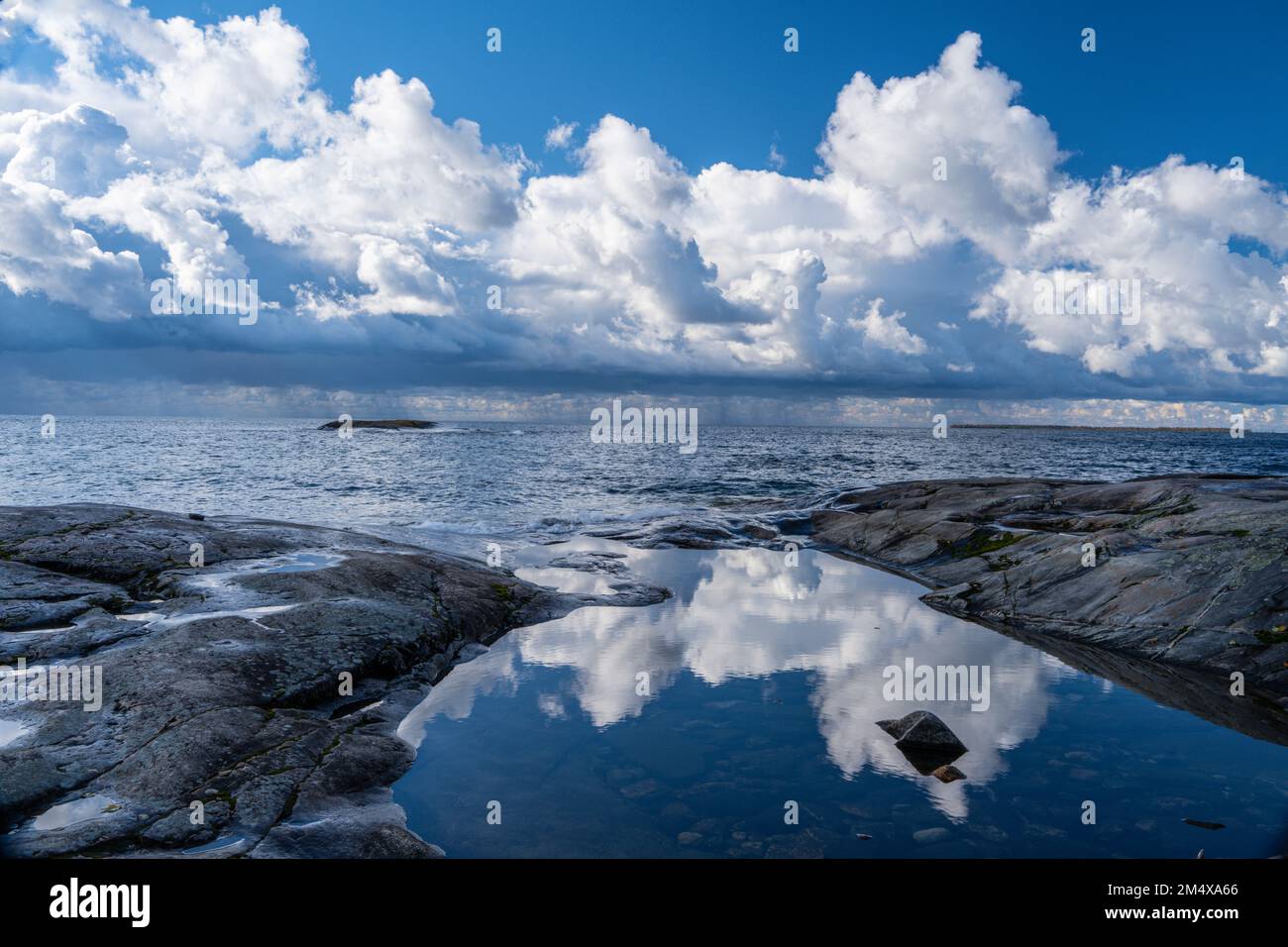 Clouds reflected in a vernal pool, Lake Superior Provincial Park ...