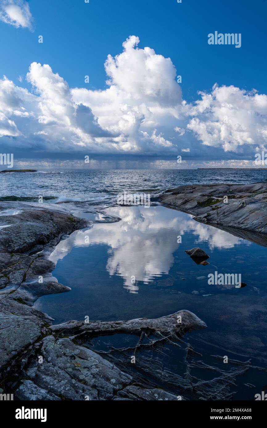 Clouds reflected in a vernal pool, Lake Superior Provincial Park ...