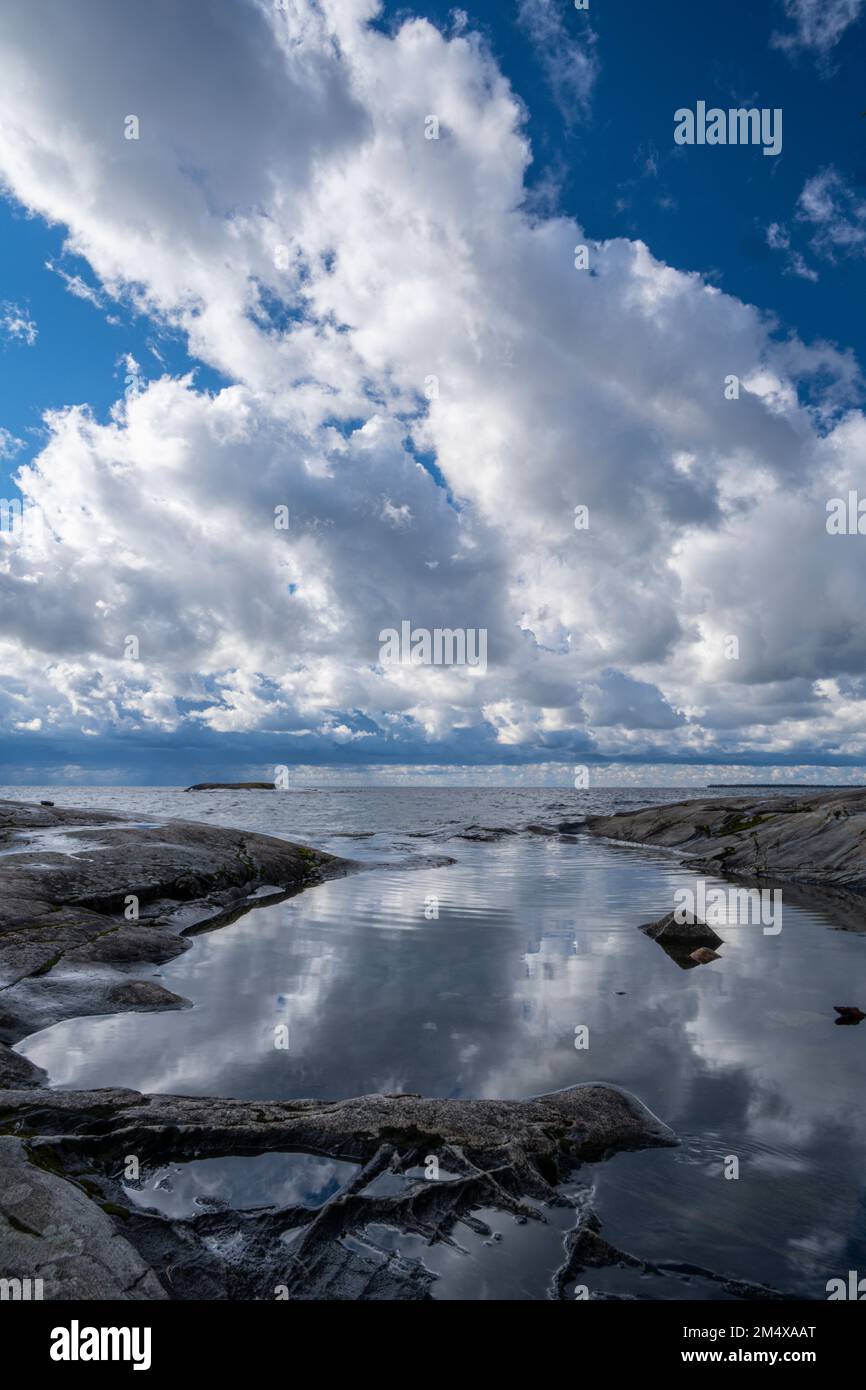 Clouds reflected in a vernal pool, Lake Superior Provincial Park ...