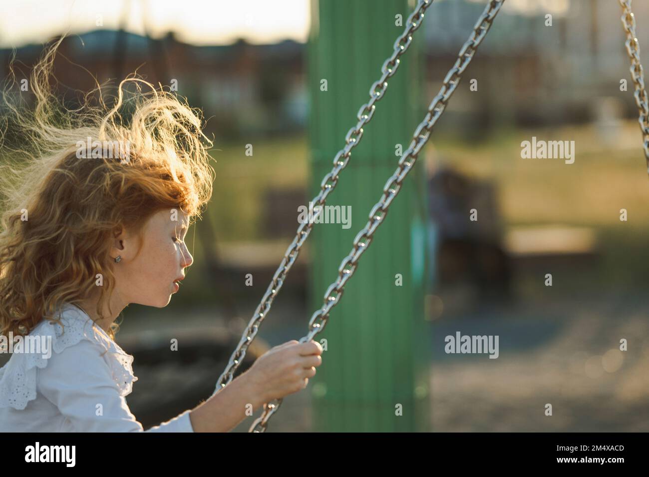 Child swinging side hi-res stock photography and images - Alamy