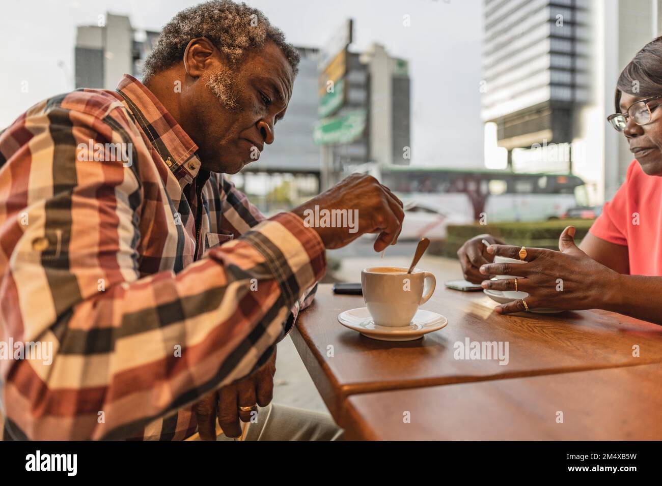 Man adding sugar coffee hi-res stock photography and images - Alamy