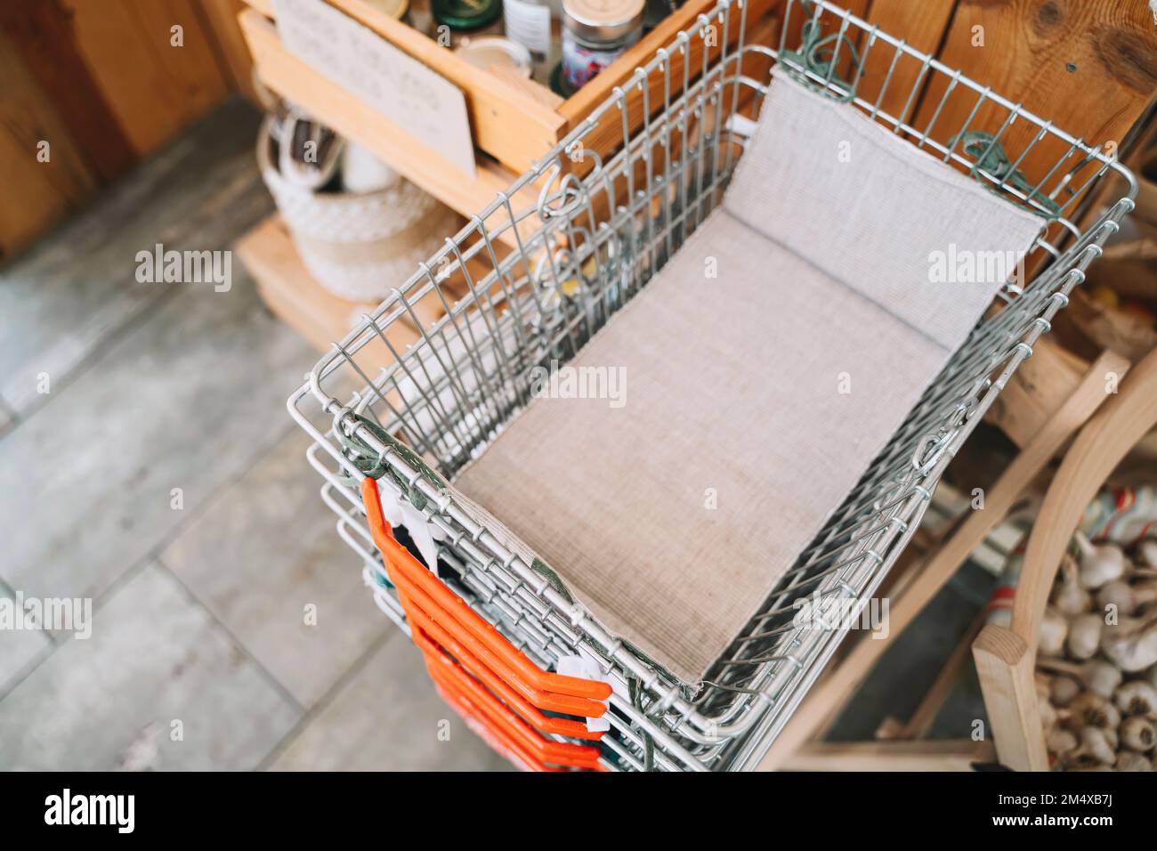 Empty shopping baskets stack in convenience store Stock Photo - Alamy