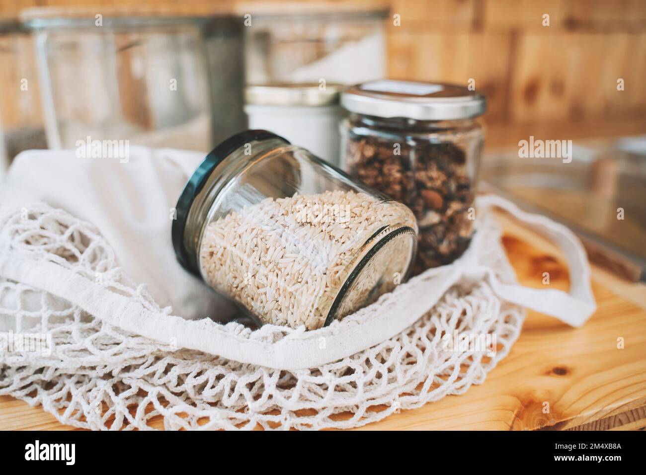 Brown rice in jar on mesh bag at zero waste store Stock Photo - Alamy