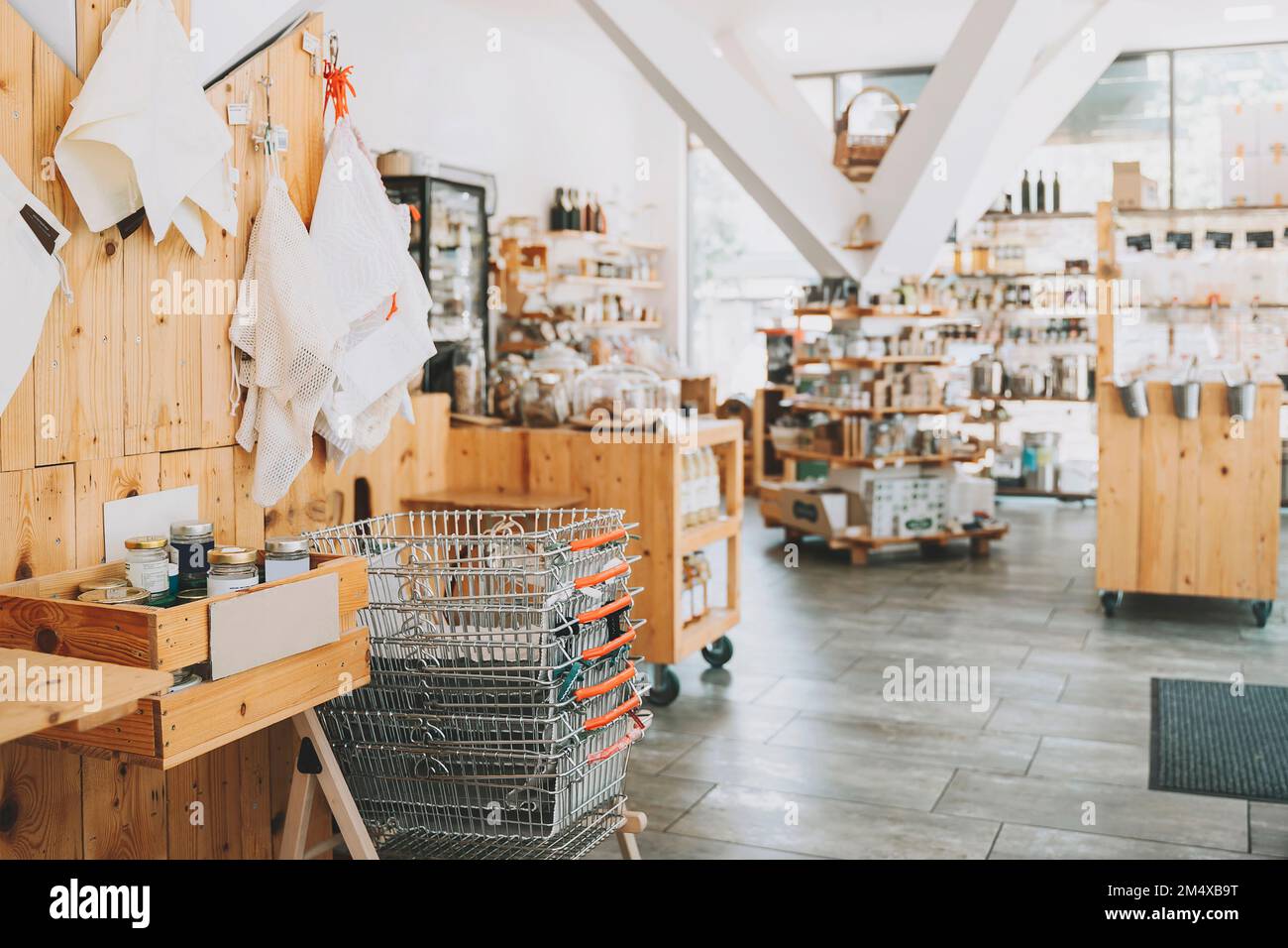 Shopping baskets stacked in sustainable shop Stock Photo - Alamy