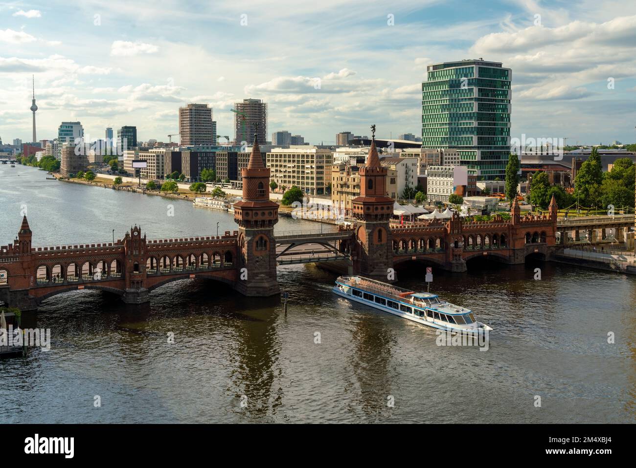 Germany, Berlin, Ferry passing under Oberbaum Bridge Stock Photo - Alamy