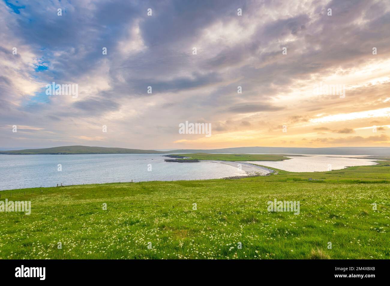 UK, Scotland, Yell, Clouds over Loch of Galtagarth at dusk Stock Photo ...