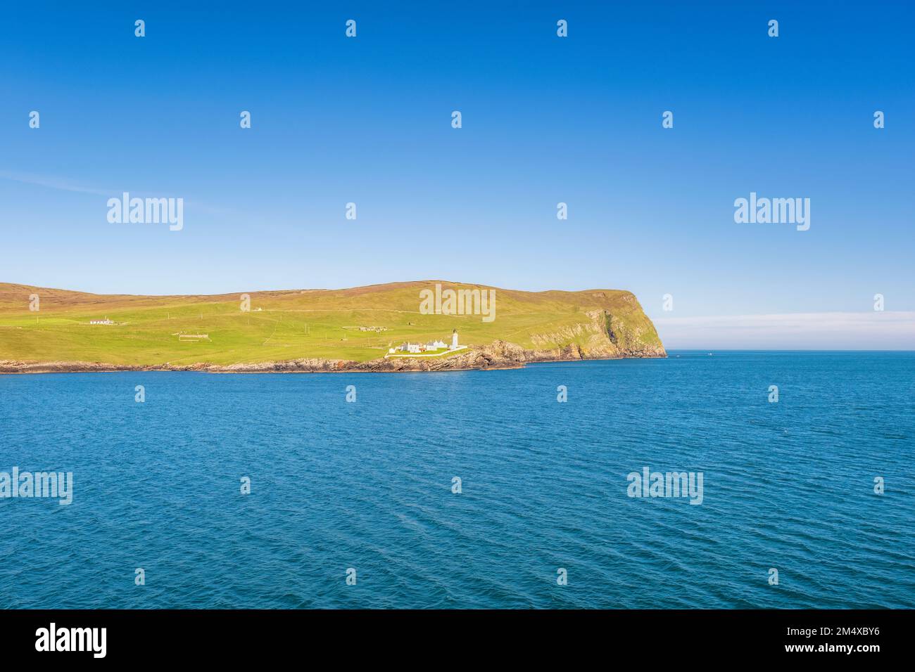 UK, Scotland, Lerwick, Shore of Bressay island with lighthouse in ...