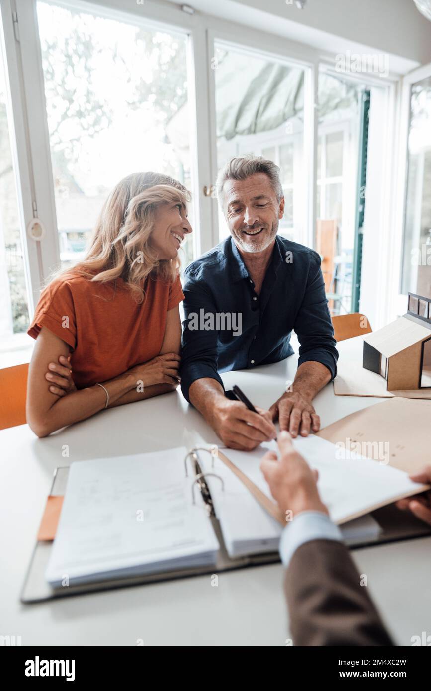 Signing document happy hi-res stock photography and images - Alamy