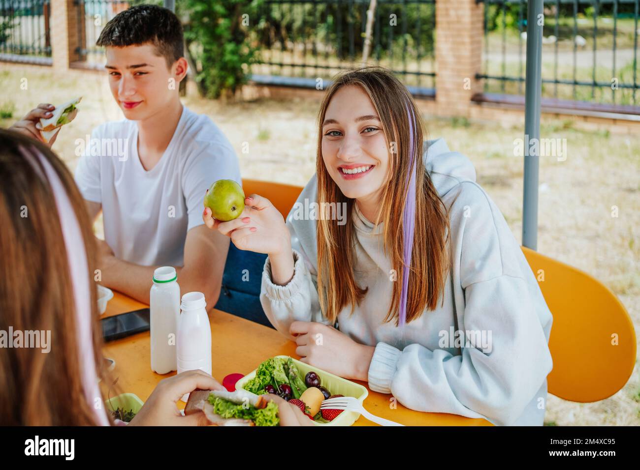 Teenage girl eating bread hi-res stock photography and images - Alamy