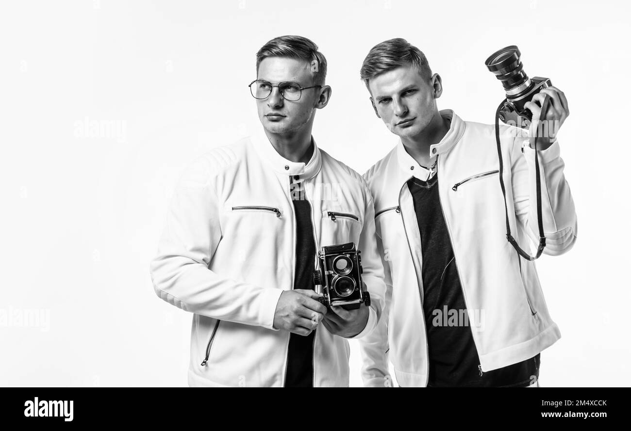 men friends. two cousin with retro photo camera. young confident ...