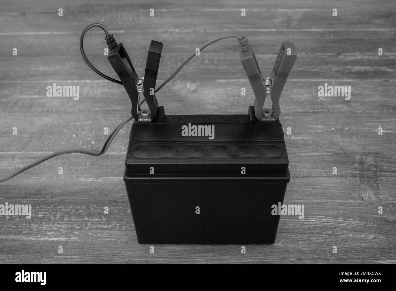 Image of a battery with charger. Reference to charging Stock Photo - Alamy