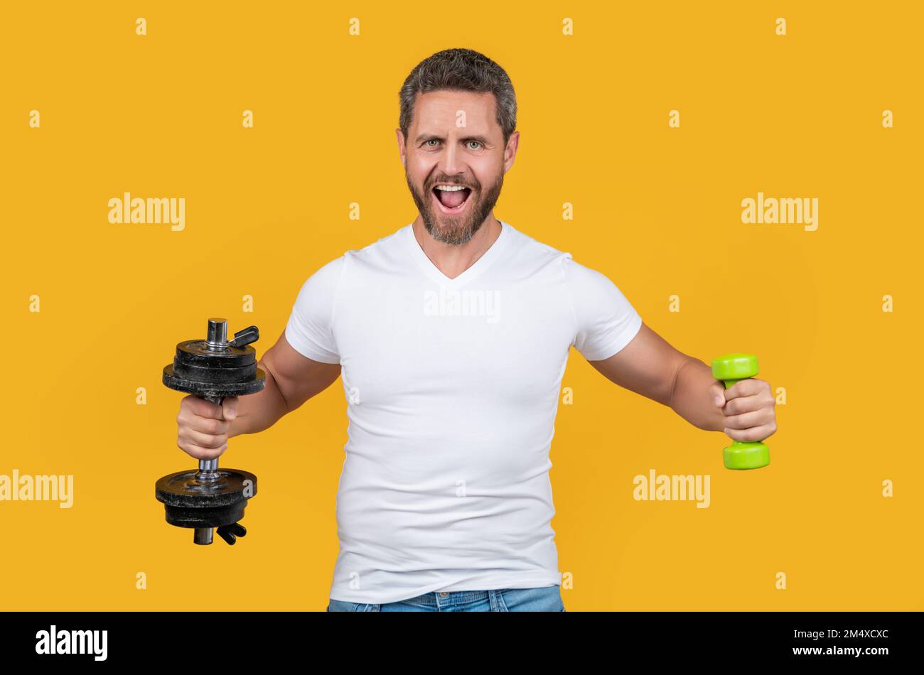 shouting strong sport man training with dumbbell. strong sport man ...