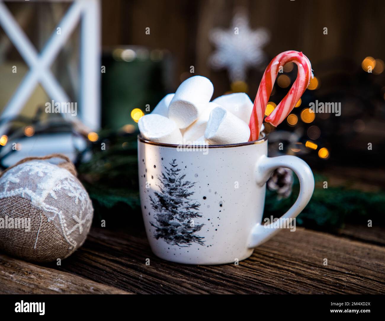 hot Christmas drink with marshmallow on wooden table Stock Photo - Alamy