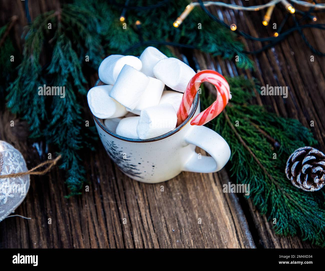 hot Christmas drink with marshmallow on wooden table Stock Photo - Alamy