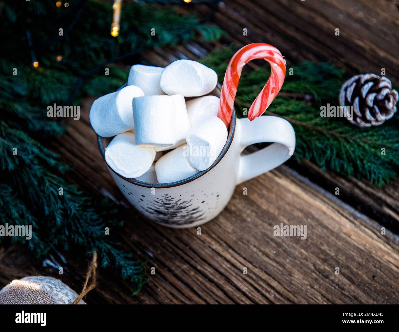 hot Christmas drink with marshmallow on wooden table Stock Photo - Alamy