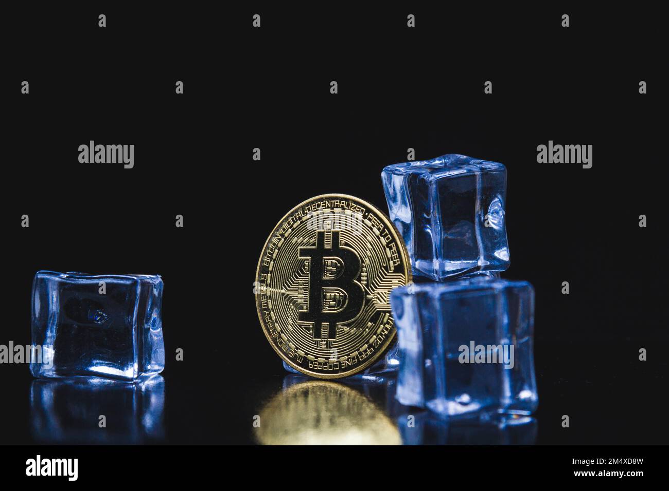 Ice and bitcoin coin. Freezing of cryptocurrency accounts. Frozen ...